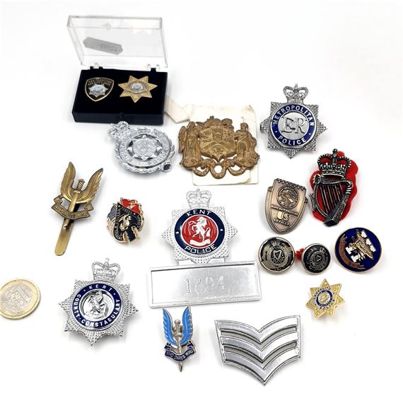 Francisco | A mixed selection of military and police, cap badges and ...