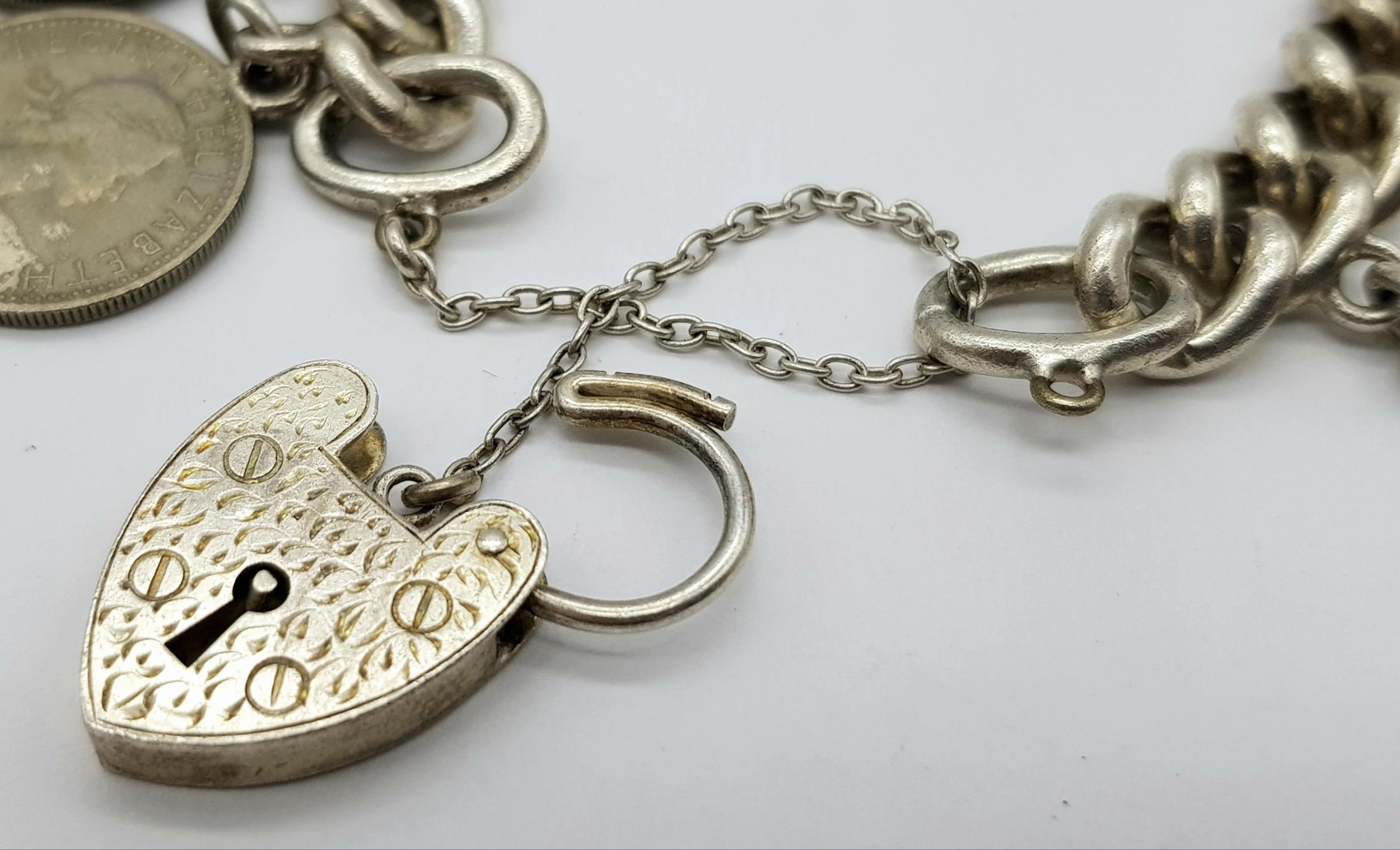 Queen Elizabeth | A SOLID SILVER BRACELET WITH HEART PADLOCK PLUS ...