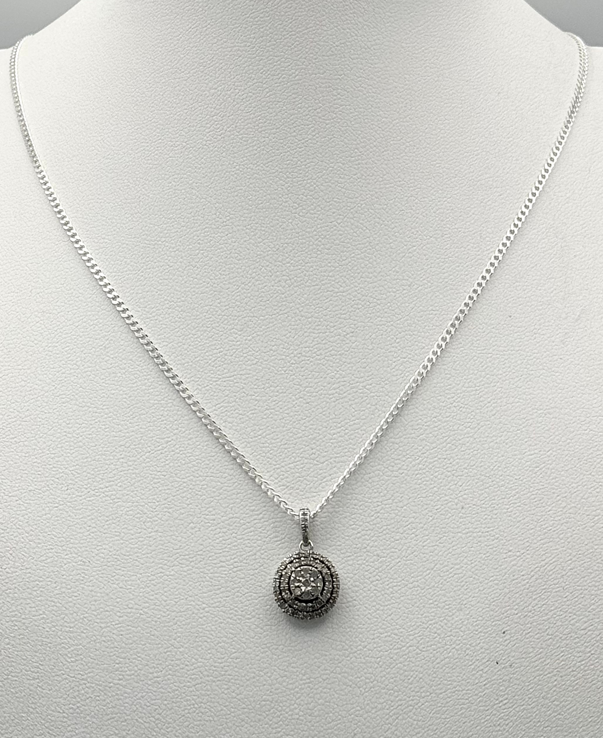 Sterling | A Sterling Silver Tier Mounted Diamond Set Pendant | MutualArt