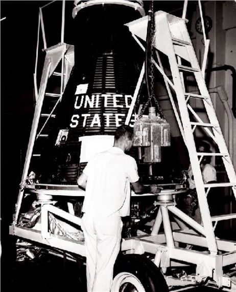 NASA | Preparation of a Mercury capsule to be placed on the fuselage of ...