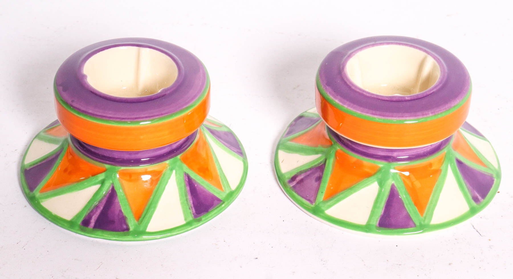 Clarice Cliff | A pair of Art Deco style candlestick holders | MutualArt
