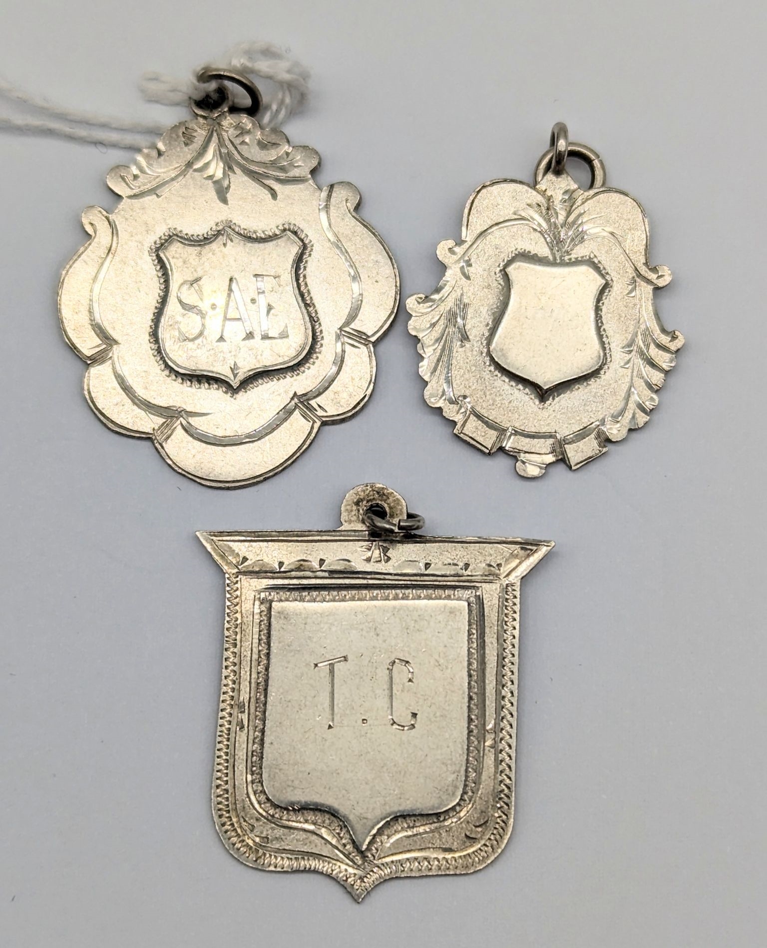 Sterling | SET OF THREE STERLING SILVER FOB MEDALLIONS | MutualArt