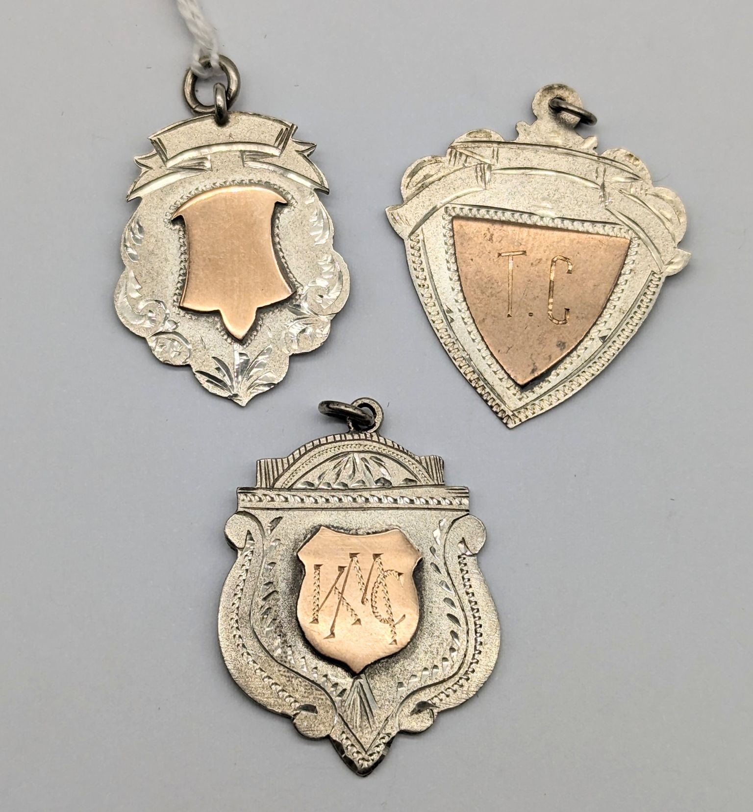 Sterling | THREE STERLING SILVER FOB MEDALLIONS | MutualArt
