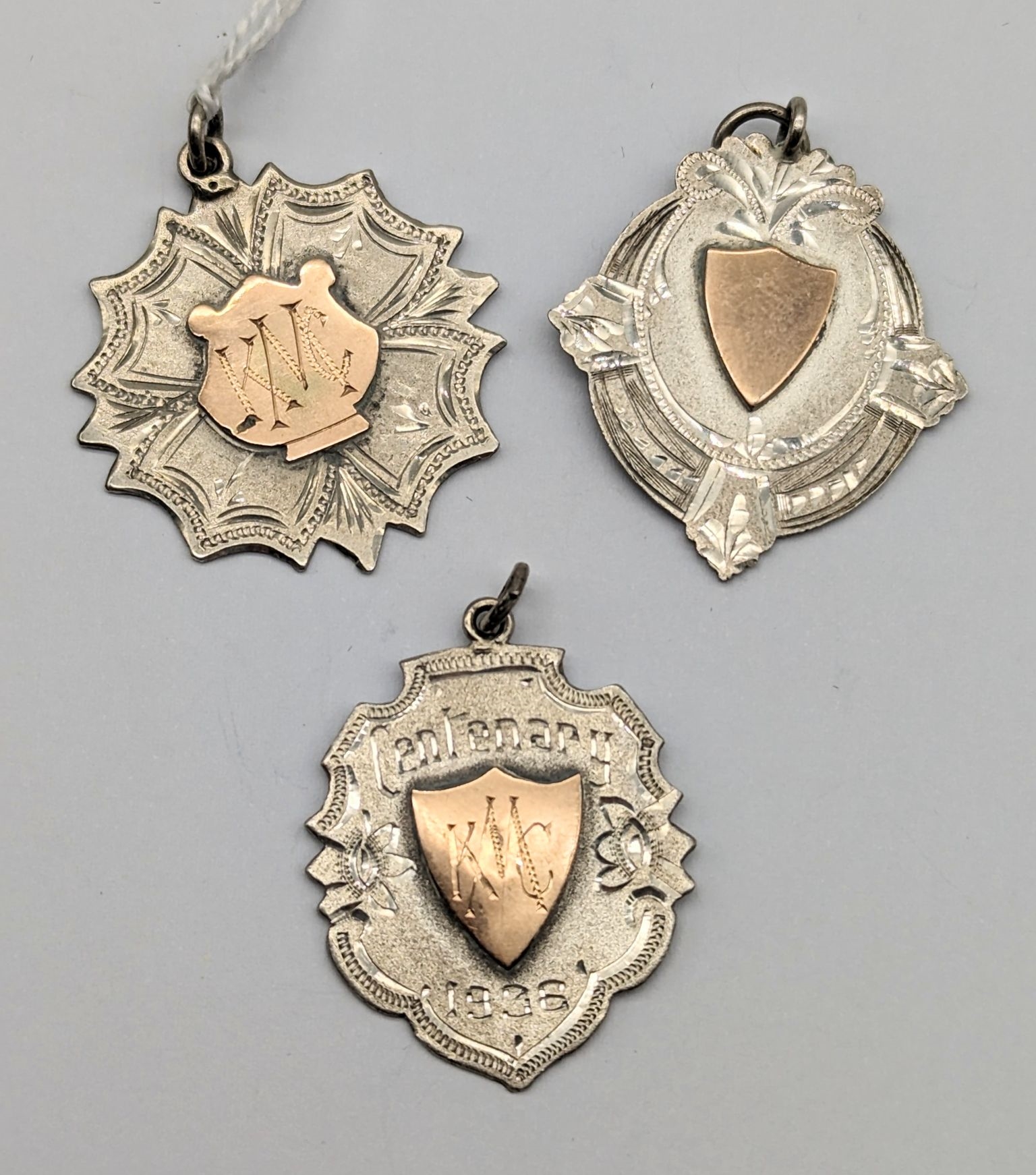 Sterling | THREE STERLING SILVER FOB MEDALLIONS | MutualArt
