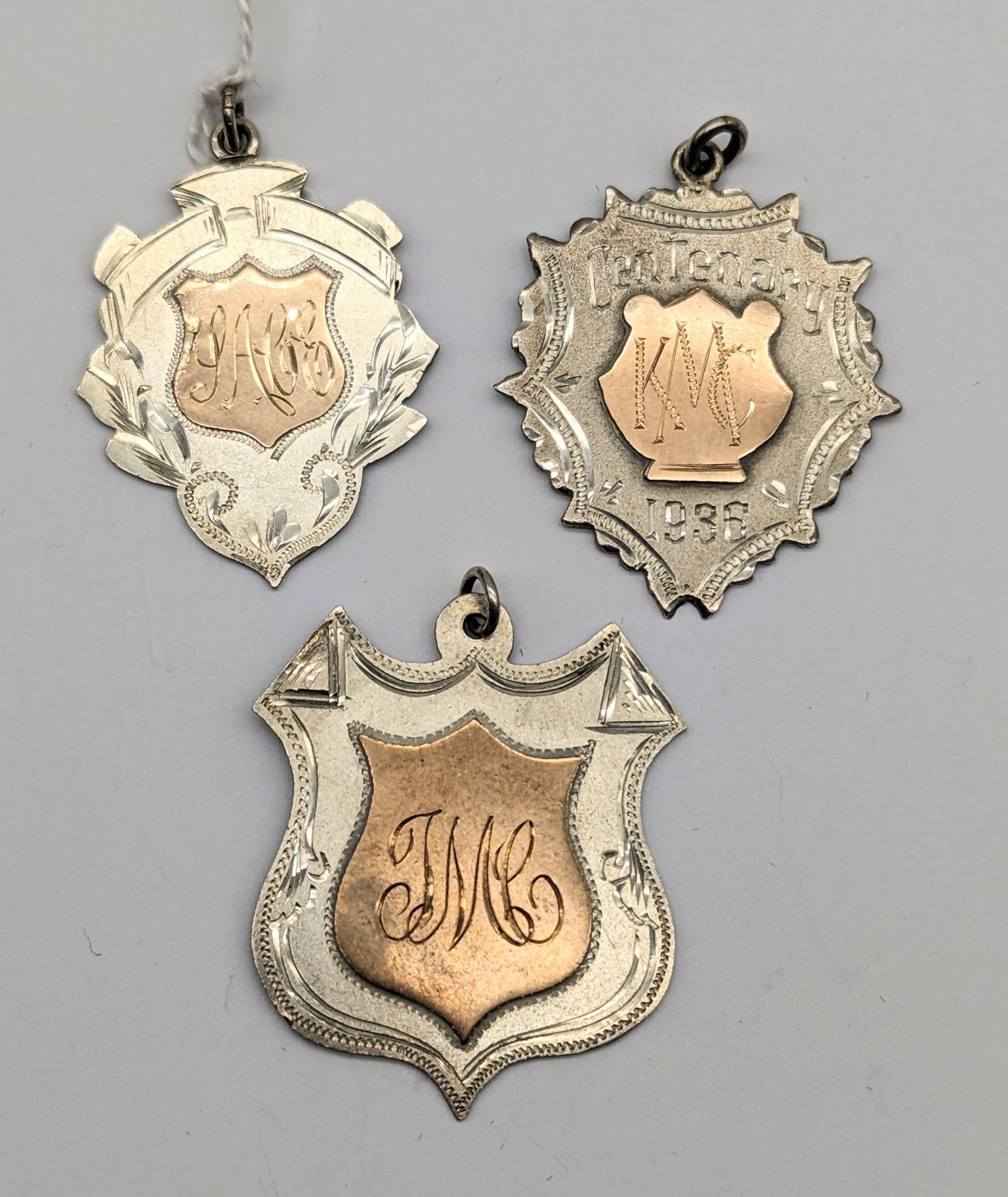 Sterling | THREE STERLING SILVER FOB MEDALLIONS | MutualArt