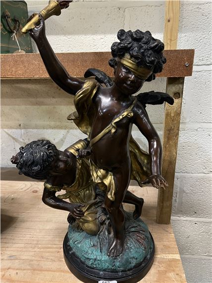 Auguste Moreau | After Auguste Moreau, a hollow bronze sculpture, of a blindfolded cherub and a ...