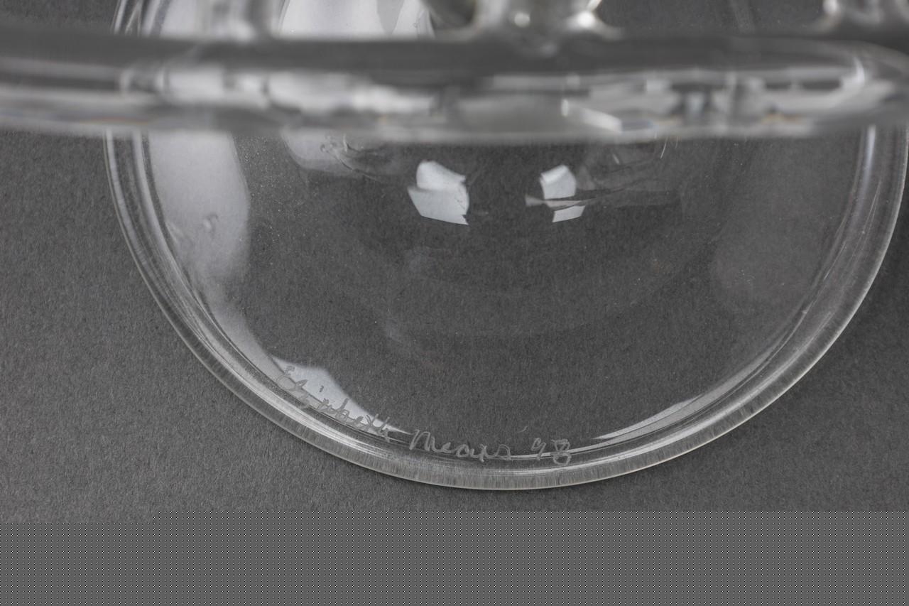 Elizabeth Ryland Mears | a free form glass sculpture depicting a masked ...