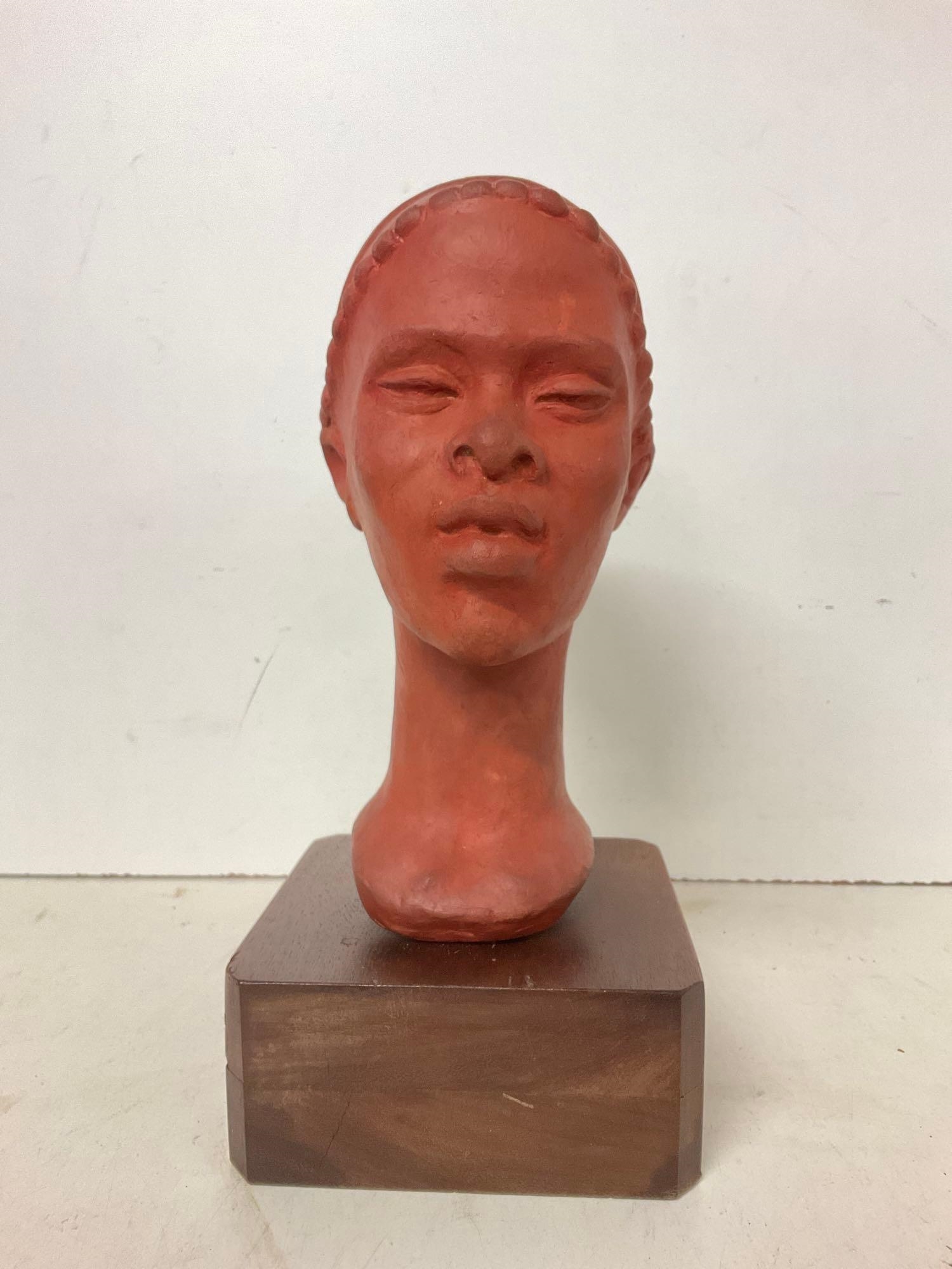Arthur Dupagne | Bust of a African woman in terracotta clay on a raised ...