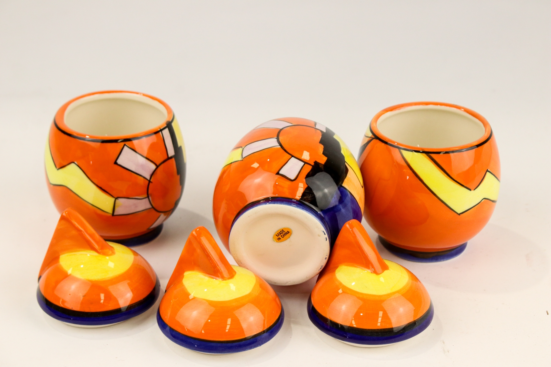 Clarice Cliff | A trio of Art Deco style lidded dishes | MutualArt