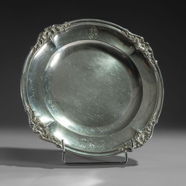Silver | Circular silver dish with contours punctuated by four clasps ...