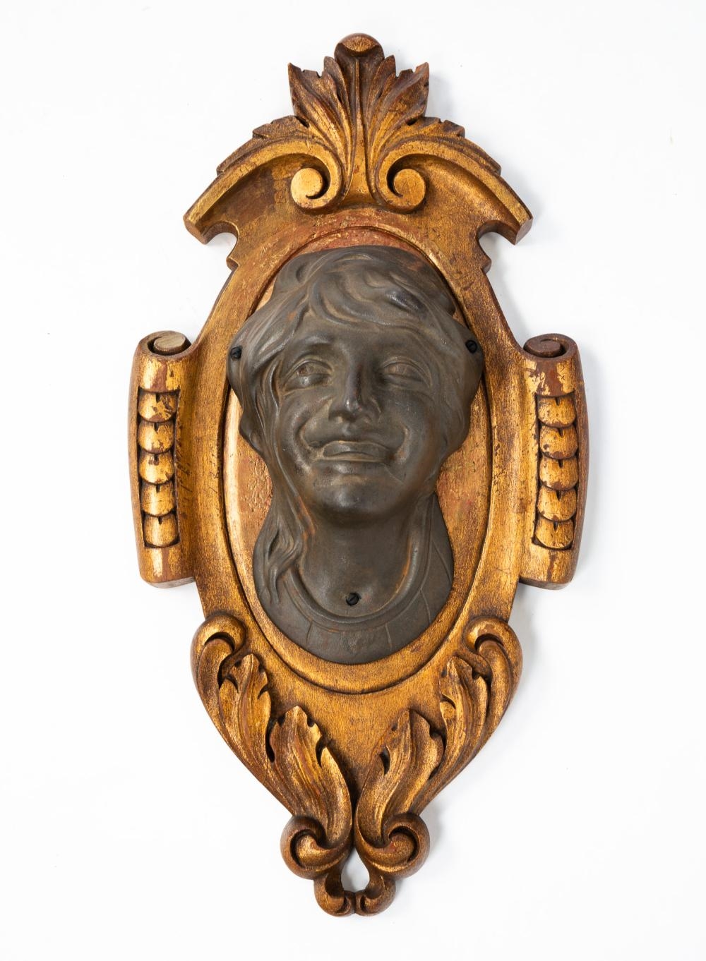 Circus | CAST IRON FACE ON GILT WOOD PLAQUE (Circa 1900) | MutualArt
