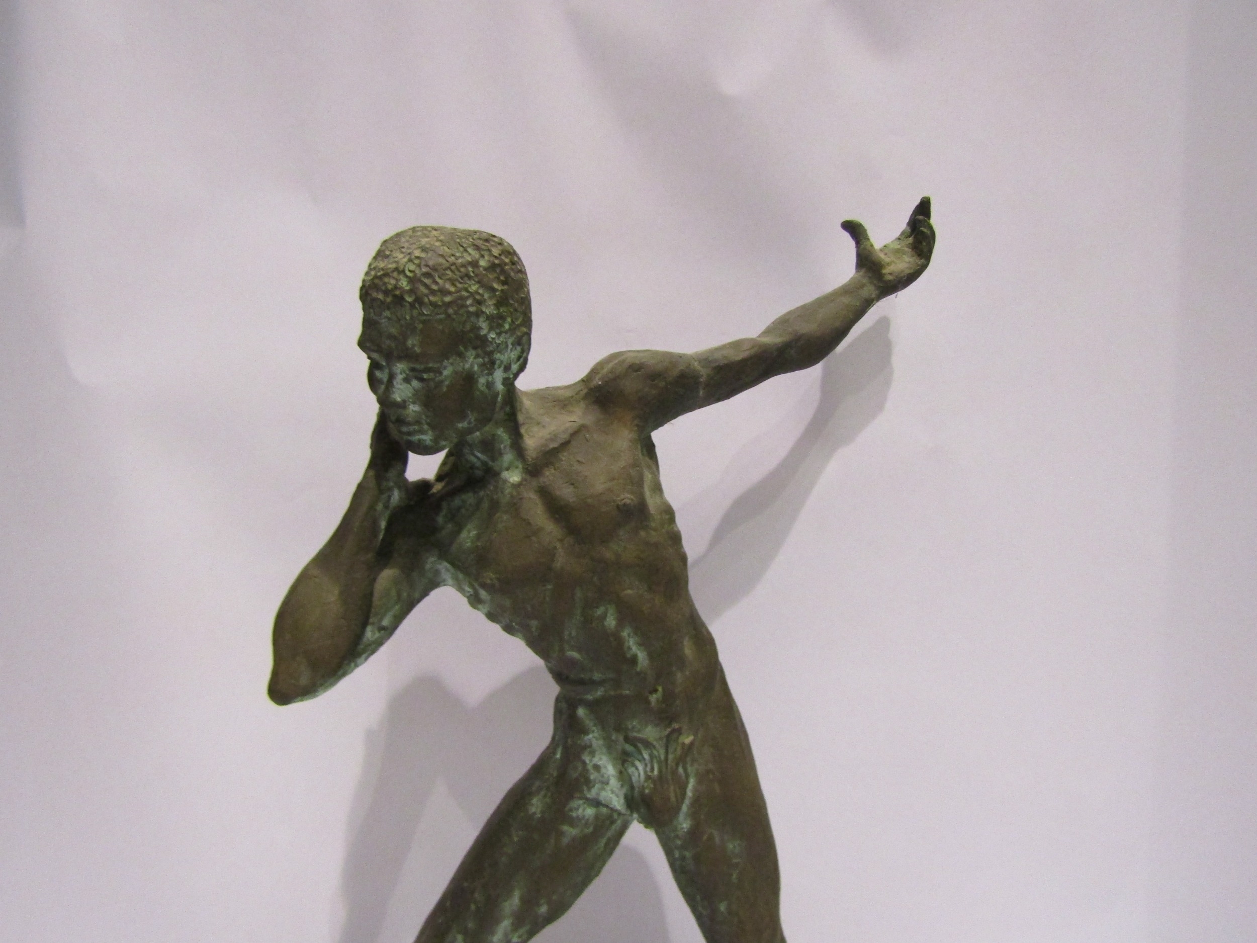 Neil Godfrey | A 20th Century bronzed resin figure of a discus thrower ...