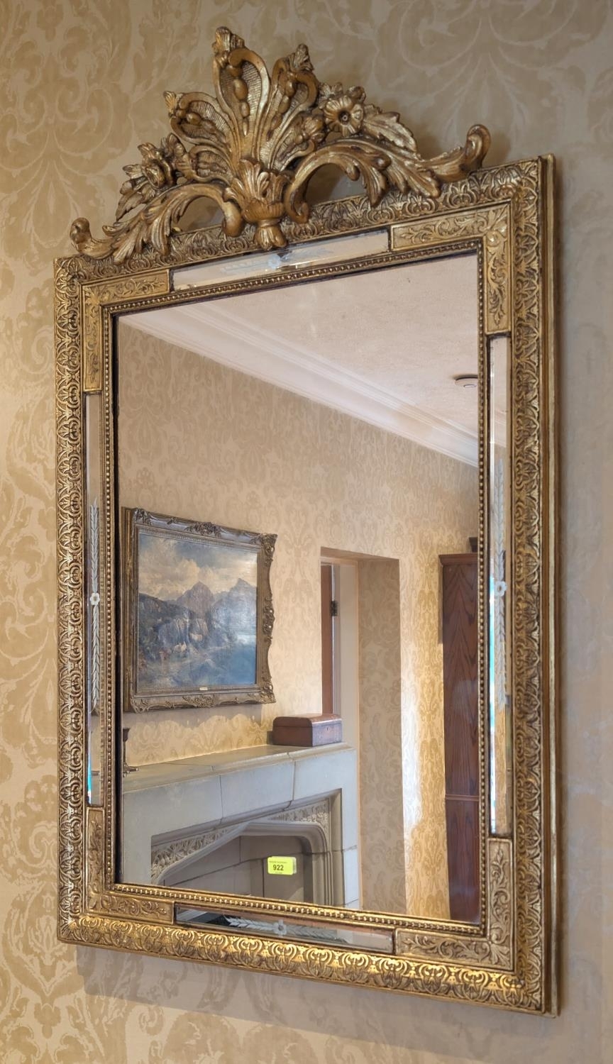 Above | A Venetian style gilt framed wall mirror with floral finial ...