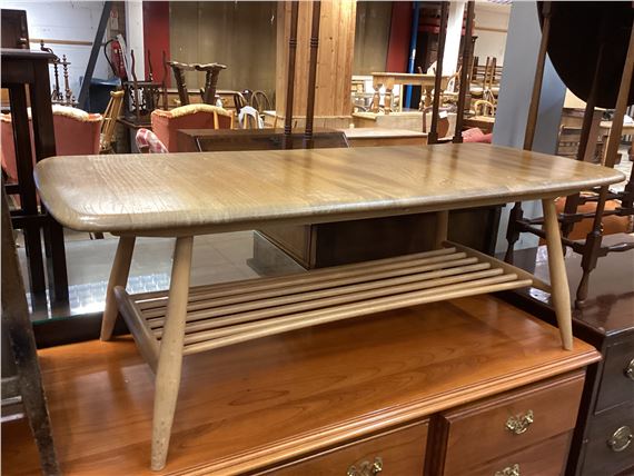 Coffee | Ercol coffee table with magazine rack undertier, 105cm x 46cm x 36.5cm high | MutualArt