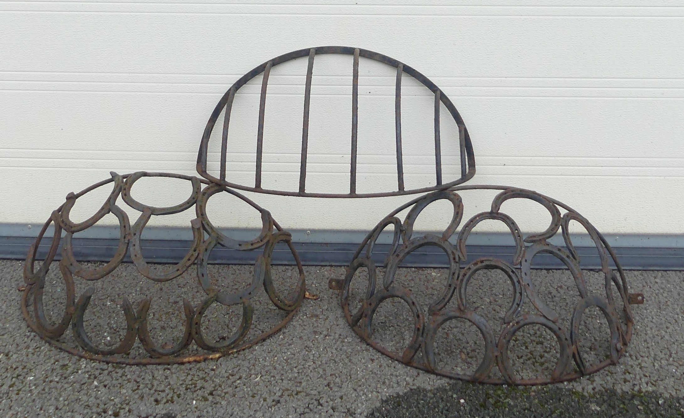 Three | Three metal garden wall planters/hay racks, two made out of ...