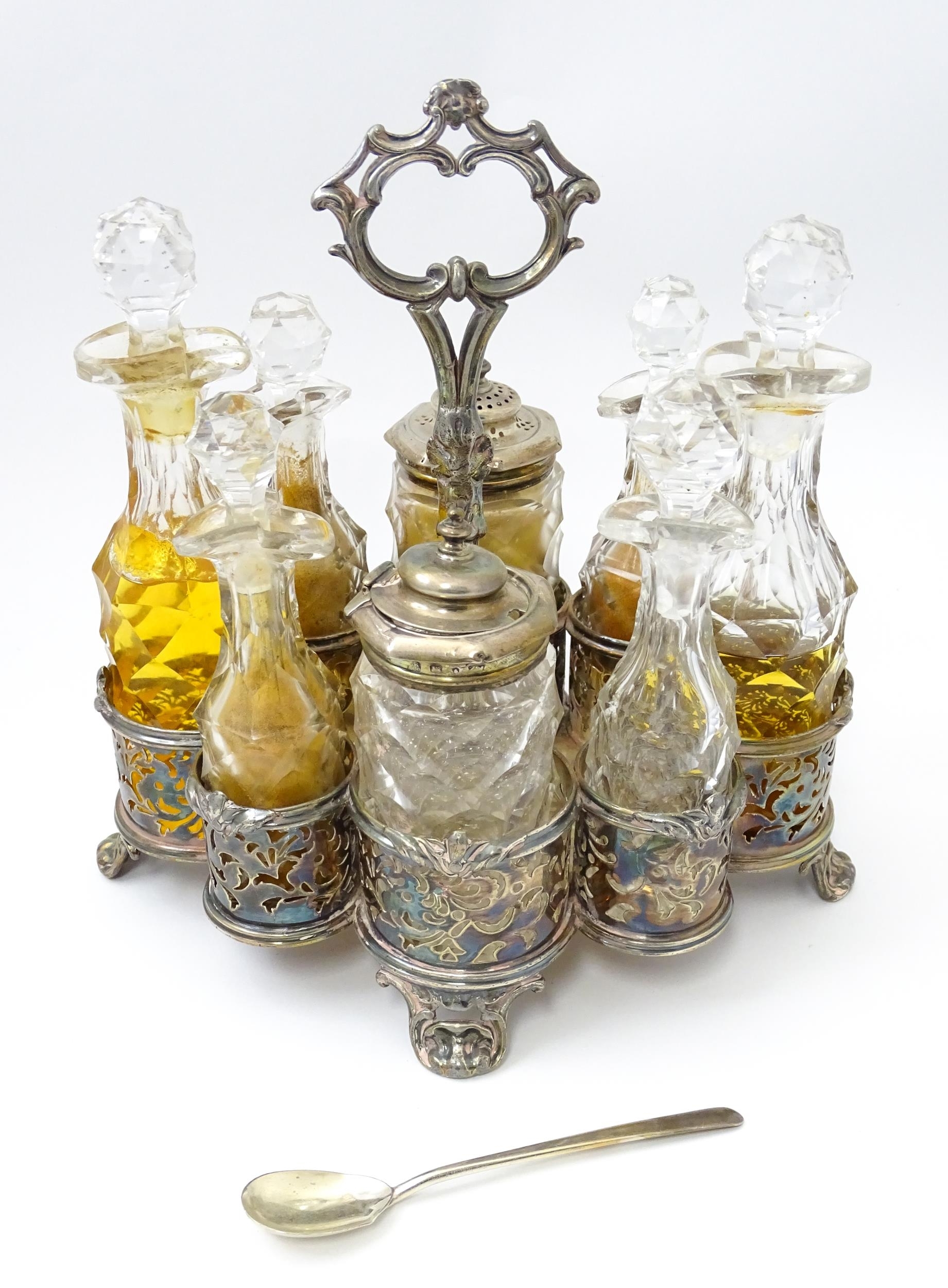 Sheffield | A Victorian cruet stand with eight cut cruet bottles, two ...