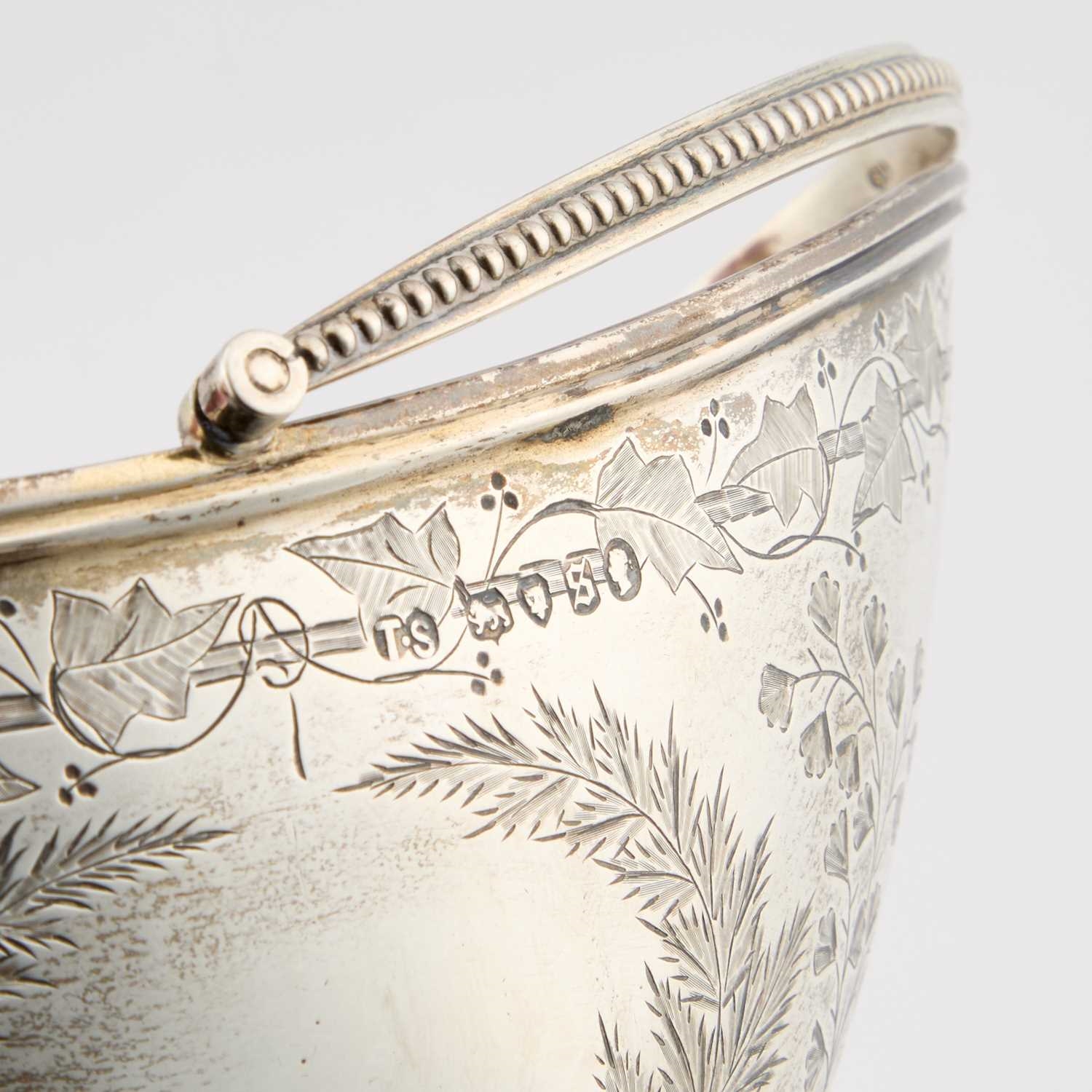 Silver | A VICTORIAN SILVER SWING-HANDLE SUGAR BASKET (1873) | MutualArt