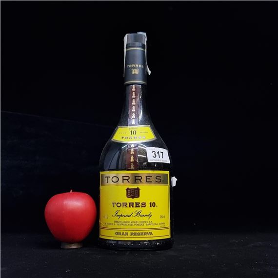 Raúl Lara-Torres | A sealed litre bottle of Torres Imperial Brandy Gran ...