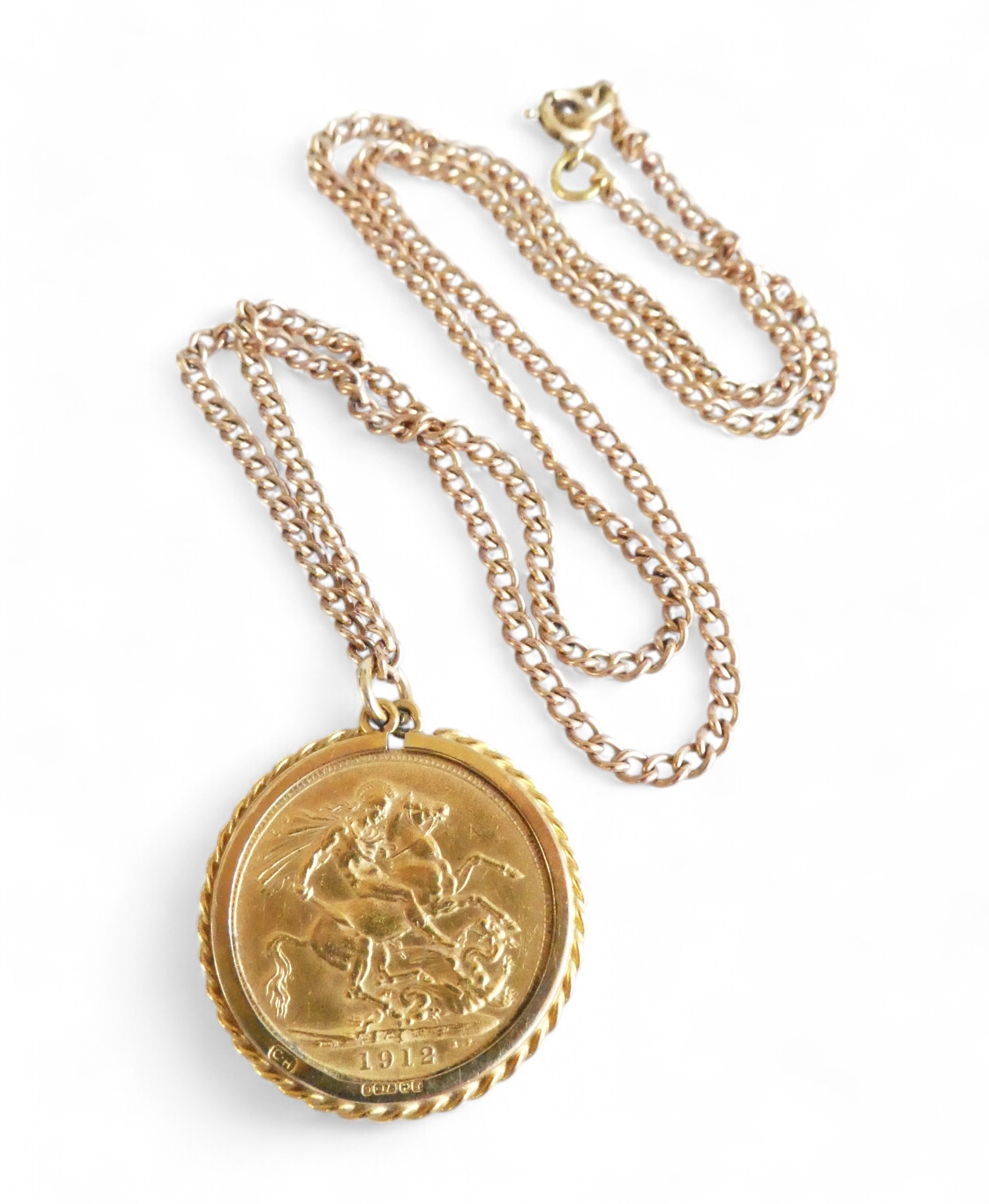 George | A gold full sovereign pendant and curblink chain necklace ...