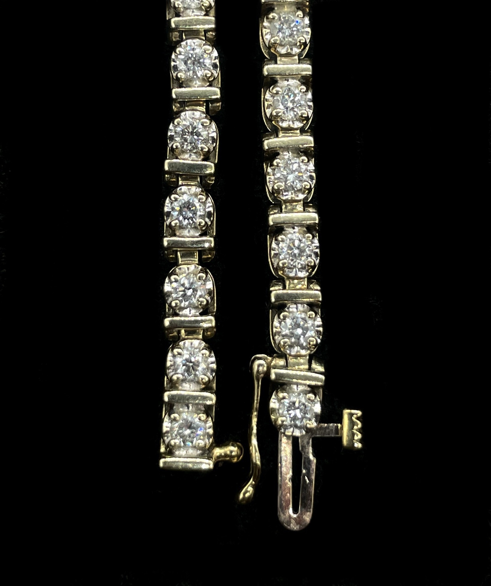 Diamond | set with thirty-six round brilliant cut diamonds totalling ...