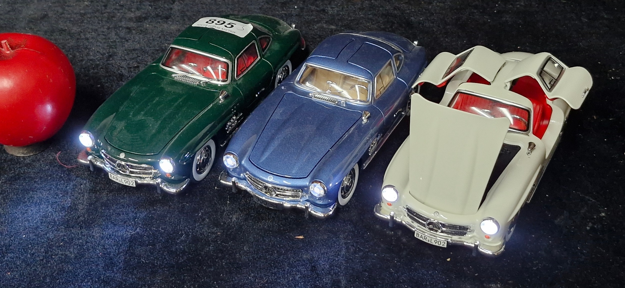 Front | Three large scale model MercedesSL classic cars, all of which ...