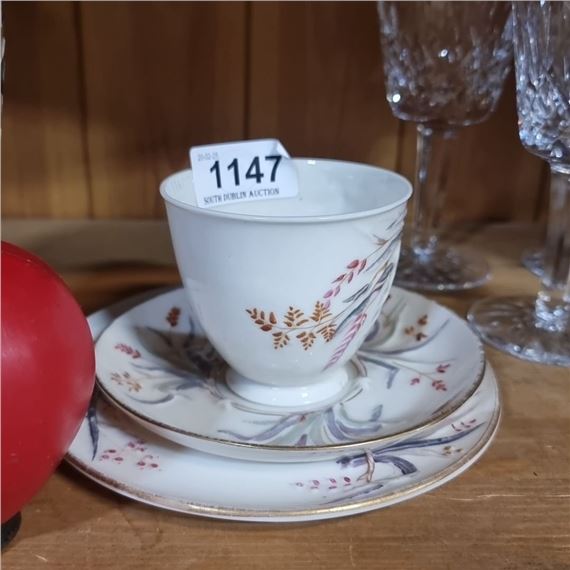 Belleek | A rare early black stamp Belleek tea trio, featuring a ...