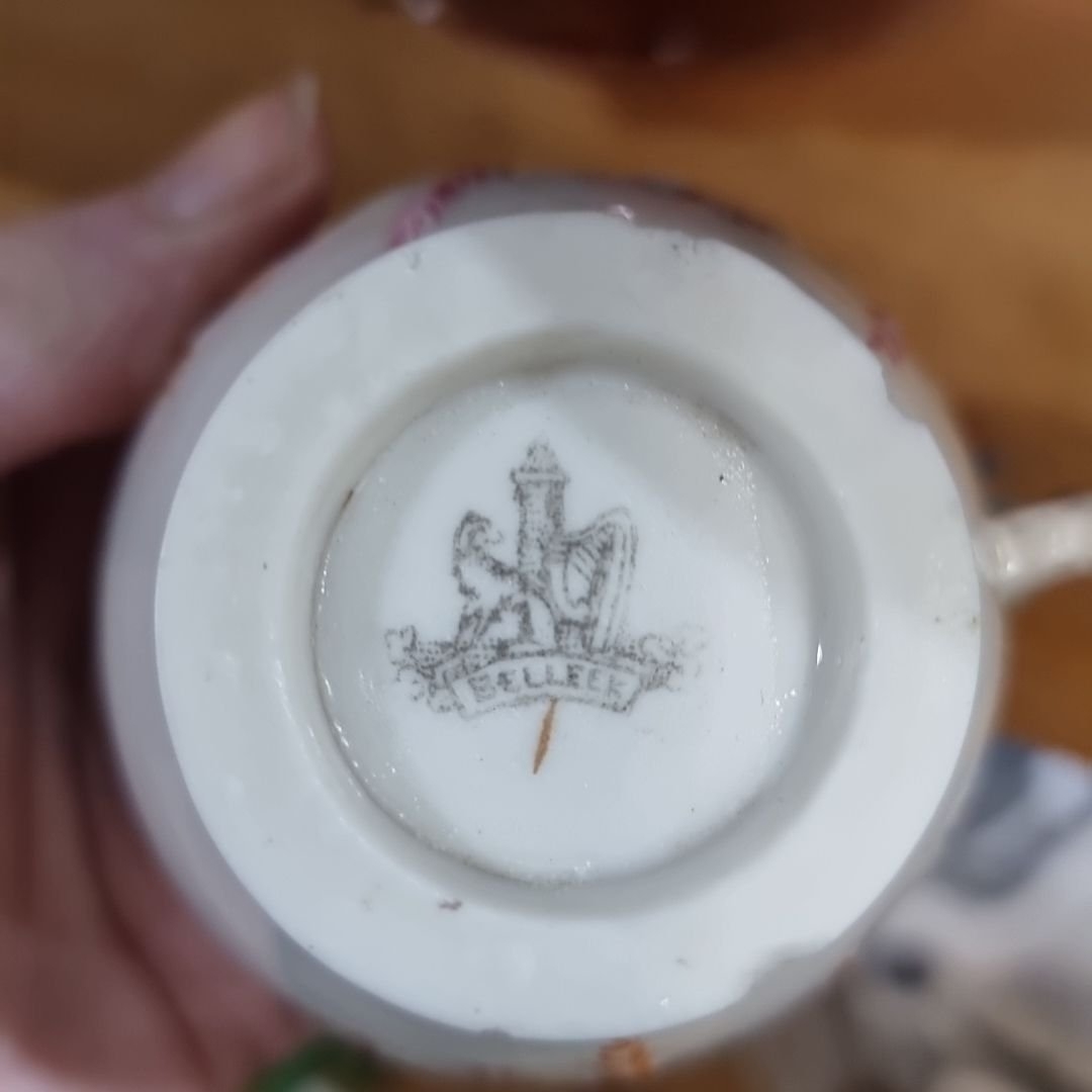 Unknown | A rare early black stamp Belleek tea trio, featuring a ...