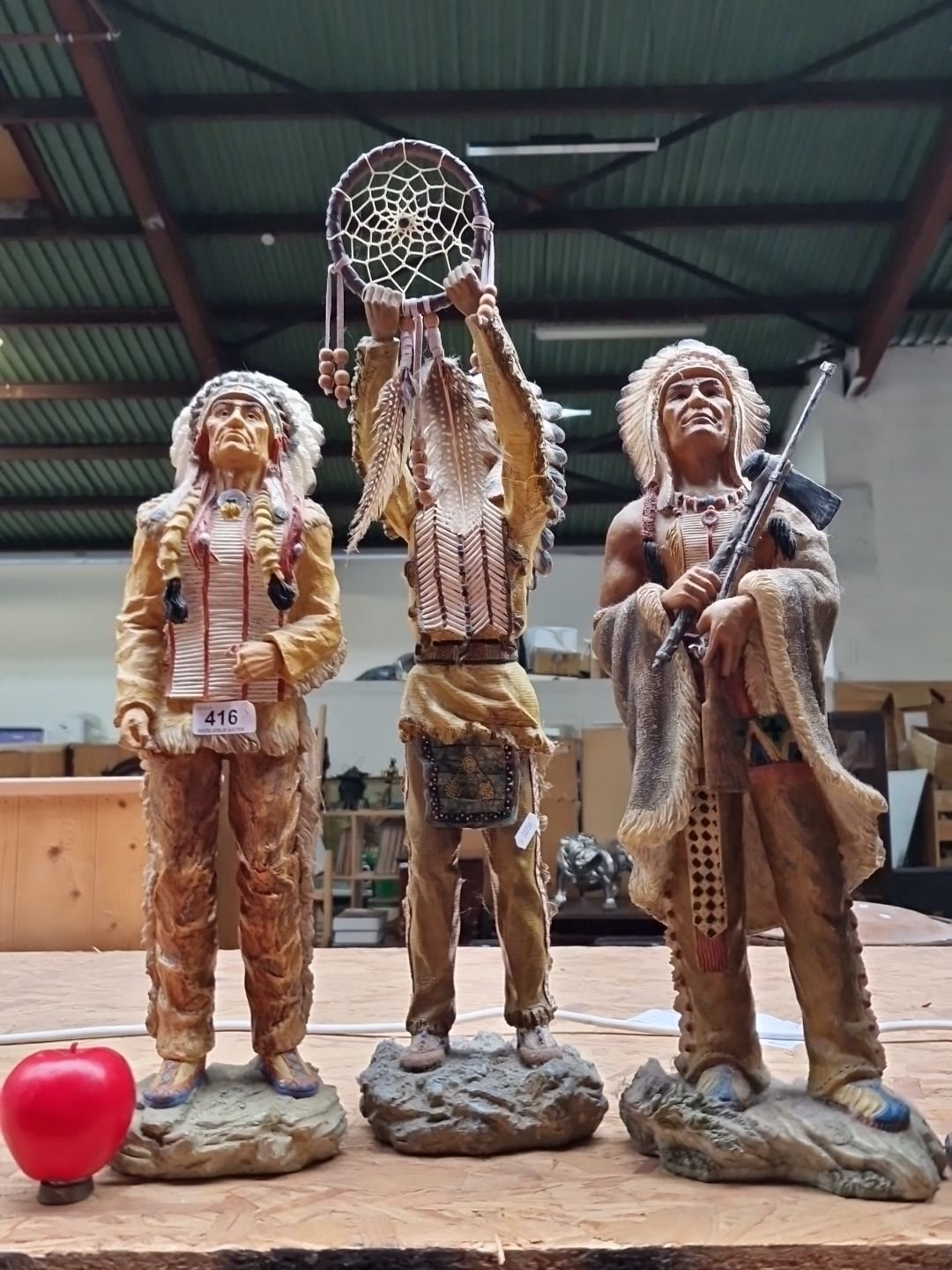 Three | Three large figures depicting Native American figures in ...