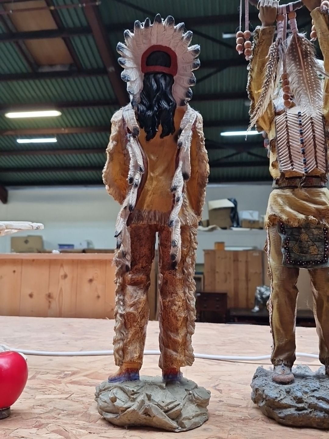 Three | Three large figures depicting Native American figures in ...