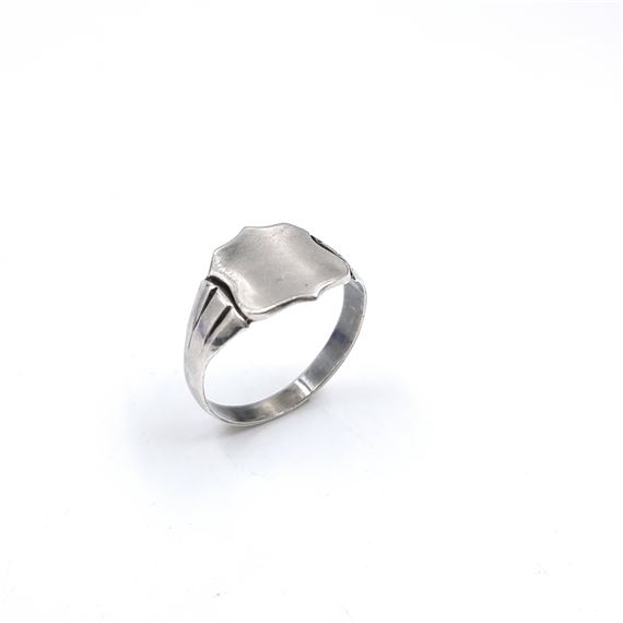 Silver | An Irish silver hallmarked blank signet ring. Size - T. Weig ...