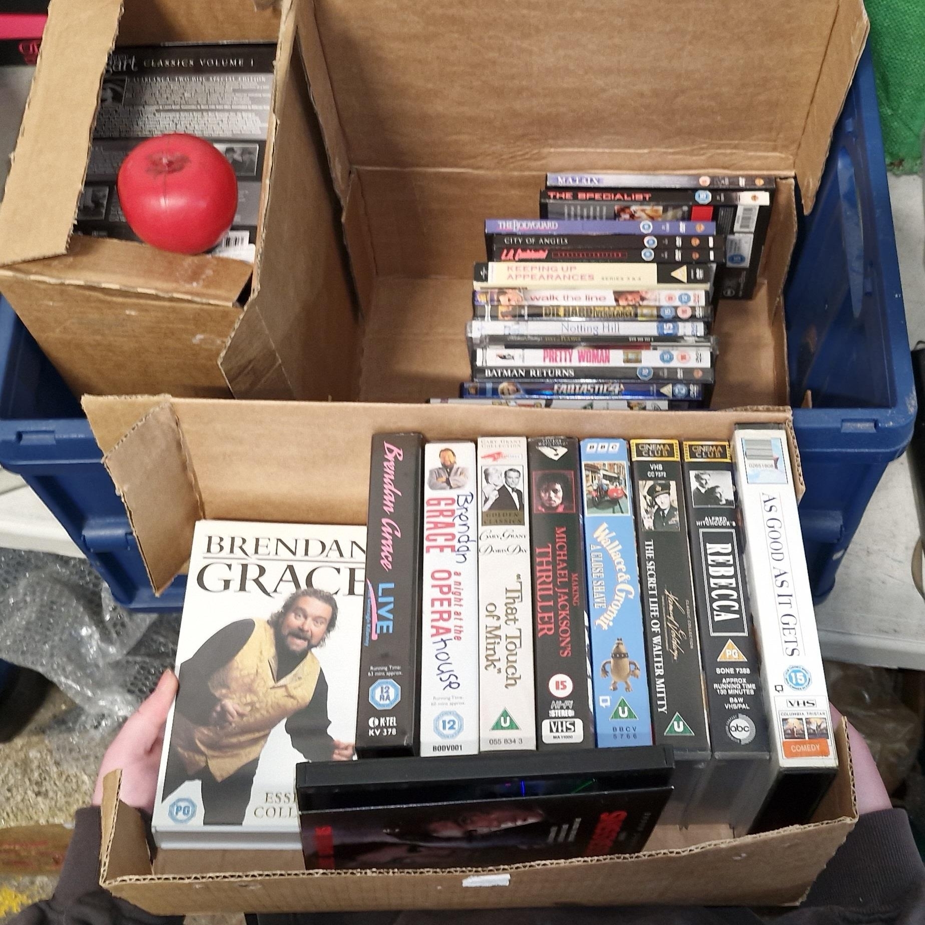 Wallace | A large blue crate containing VHS movie tapes including As ...