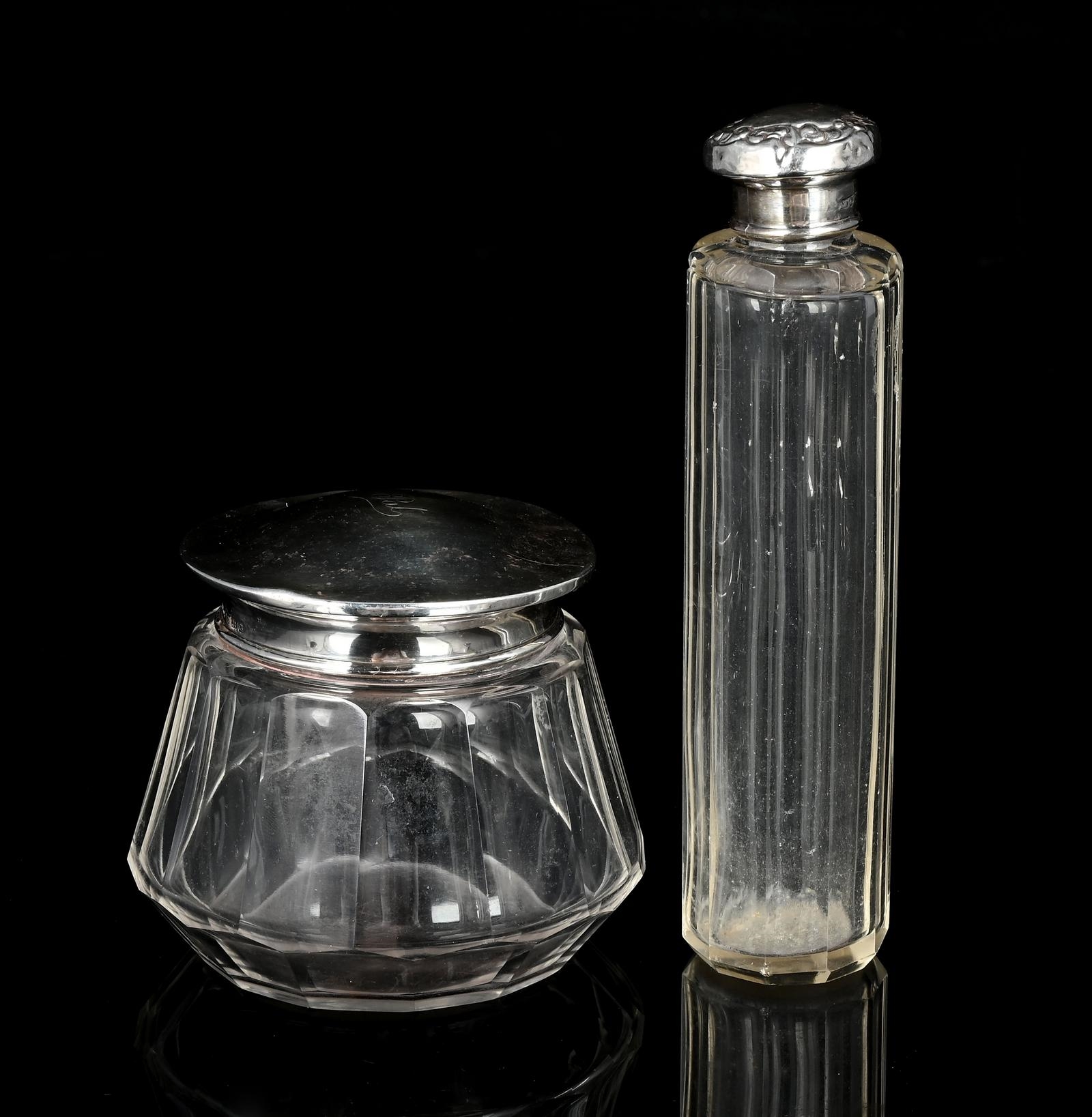 Silver | Four silver topped dressing table bottles and a silver plated ...
