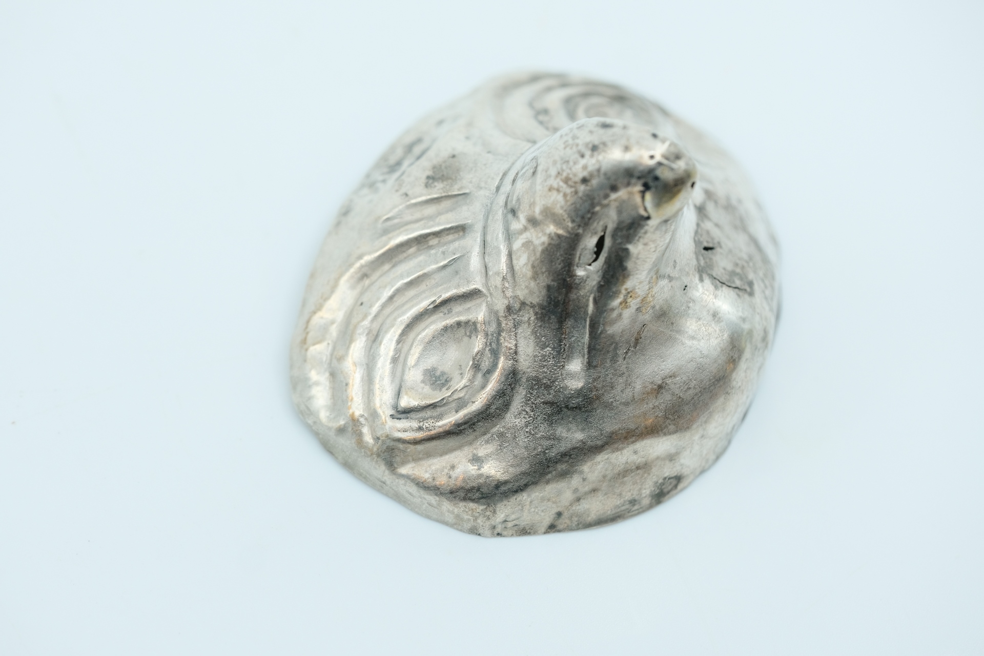 Silver | PRE-COLUMBIAN SILVER MOCHE AVIAN MASKETTE | MutualArt