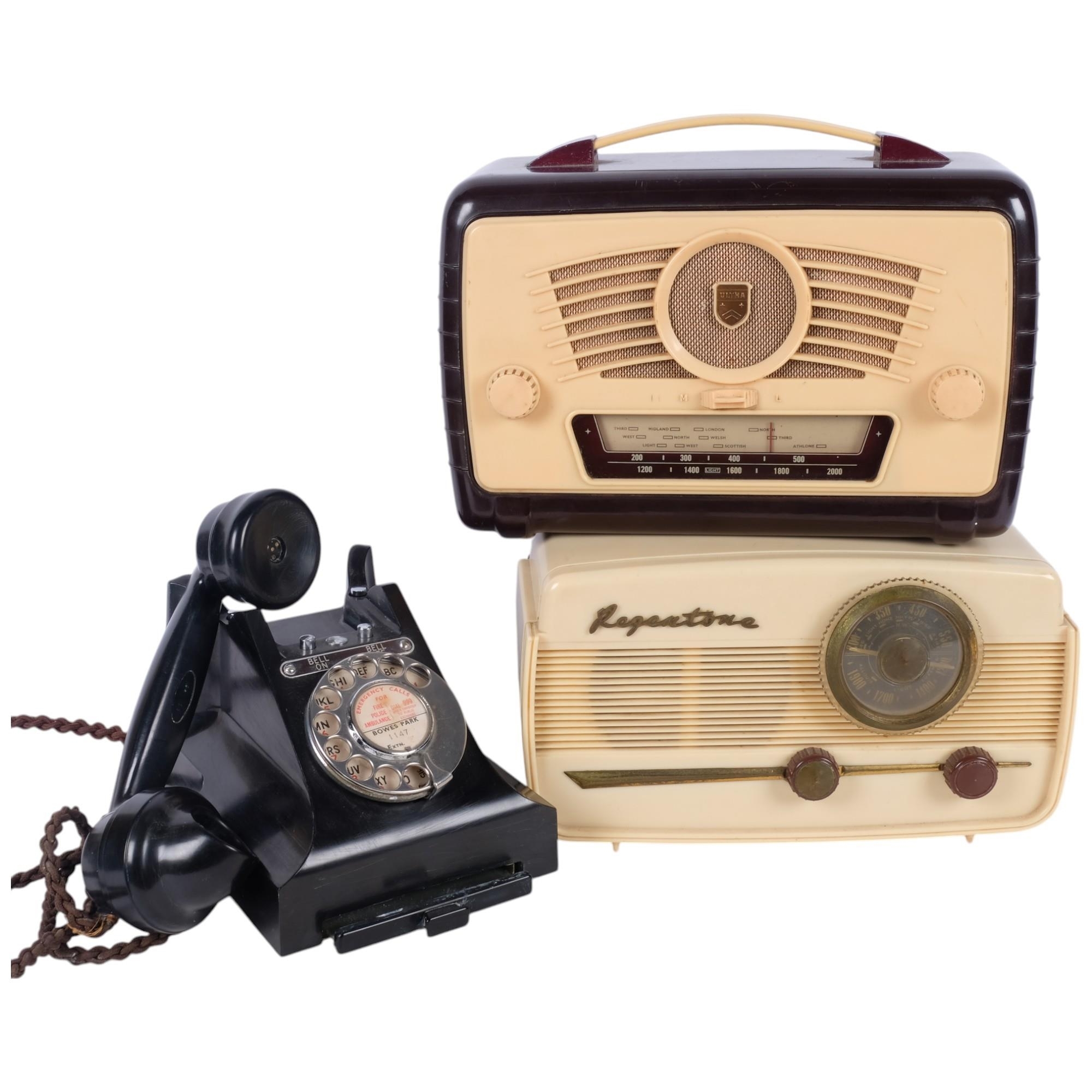 Black | A black Bakelite dial telephone with drawer under, a Bakelite ...