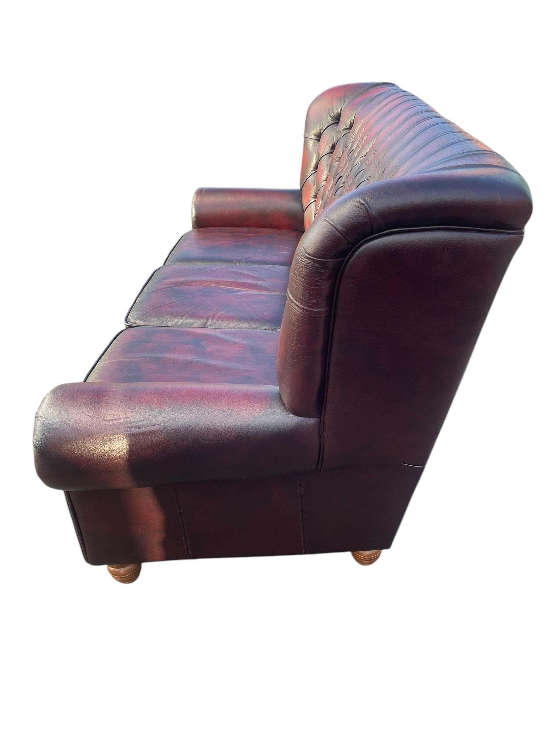 Chesterfield | A modern maroon leather Chesterfield type wingback three ...