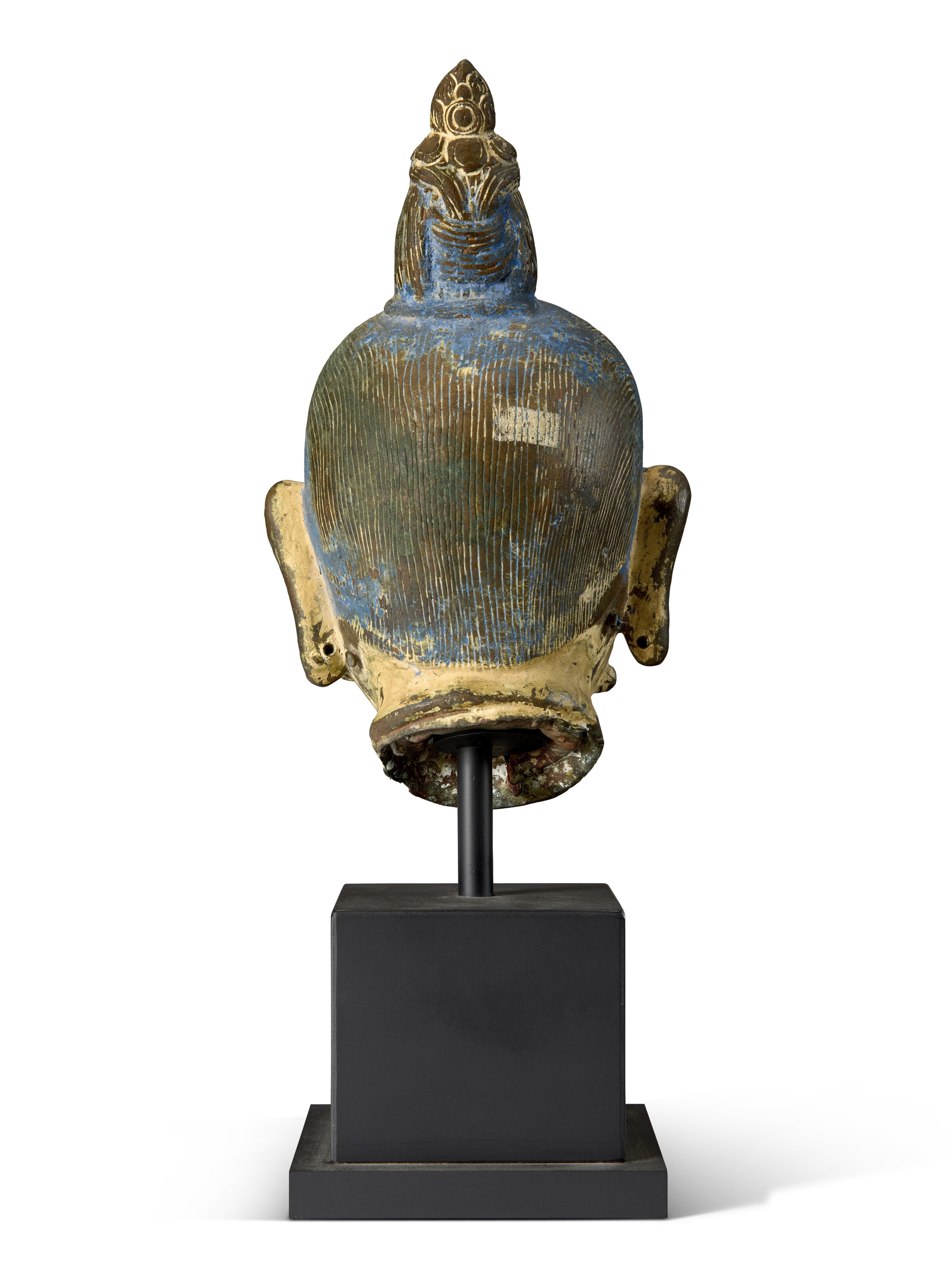 Tibetan School, 18th Century | A POLYCHROMED BRONZE HEAD OF A GUARDIAN ...