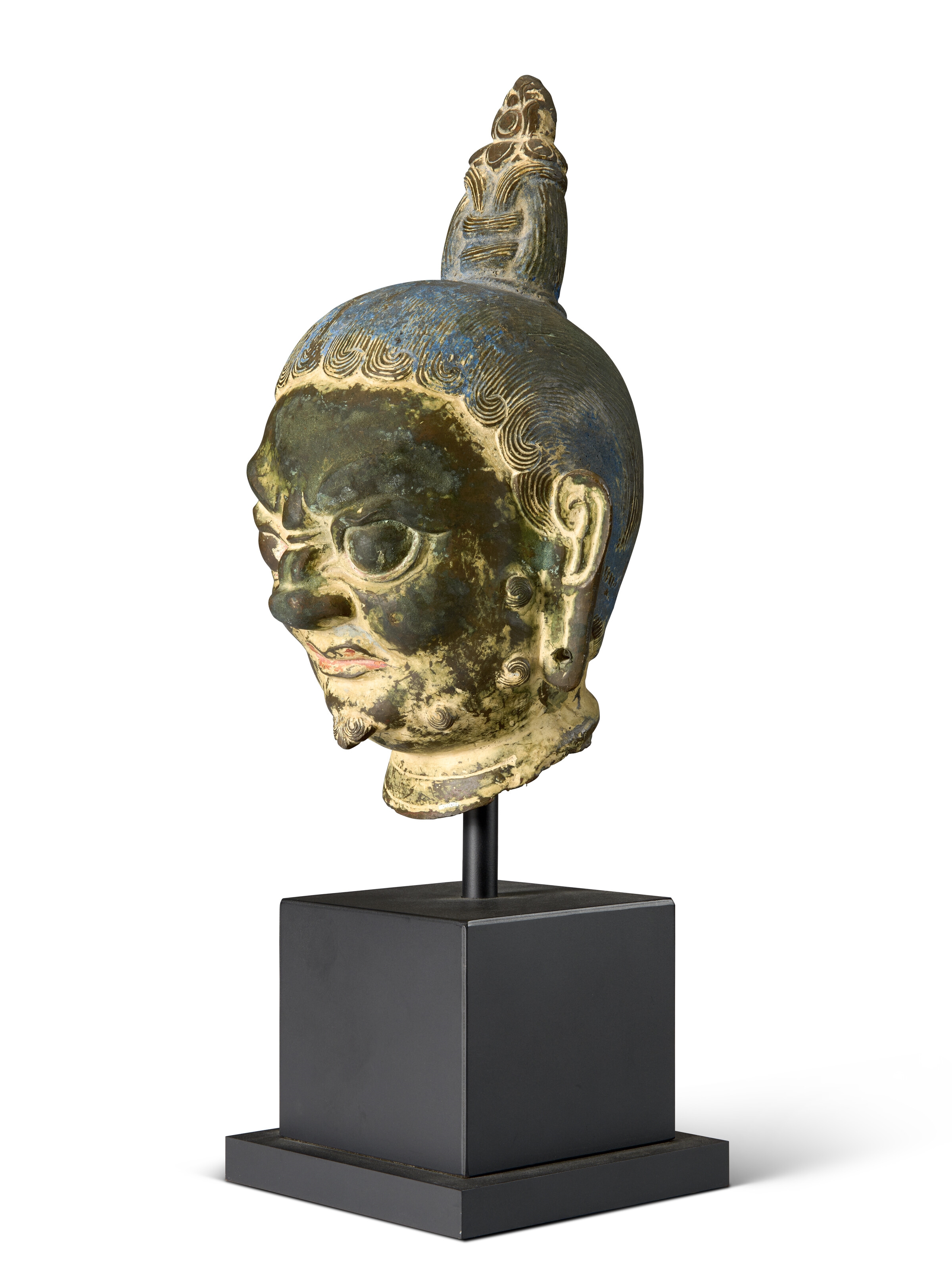 Tibetan School, 18th Century | A POLYCHROMED BRONZE HEAD OF A GUARDIAN ...