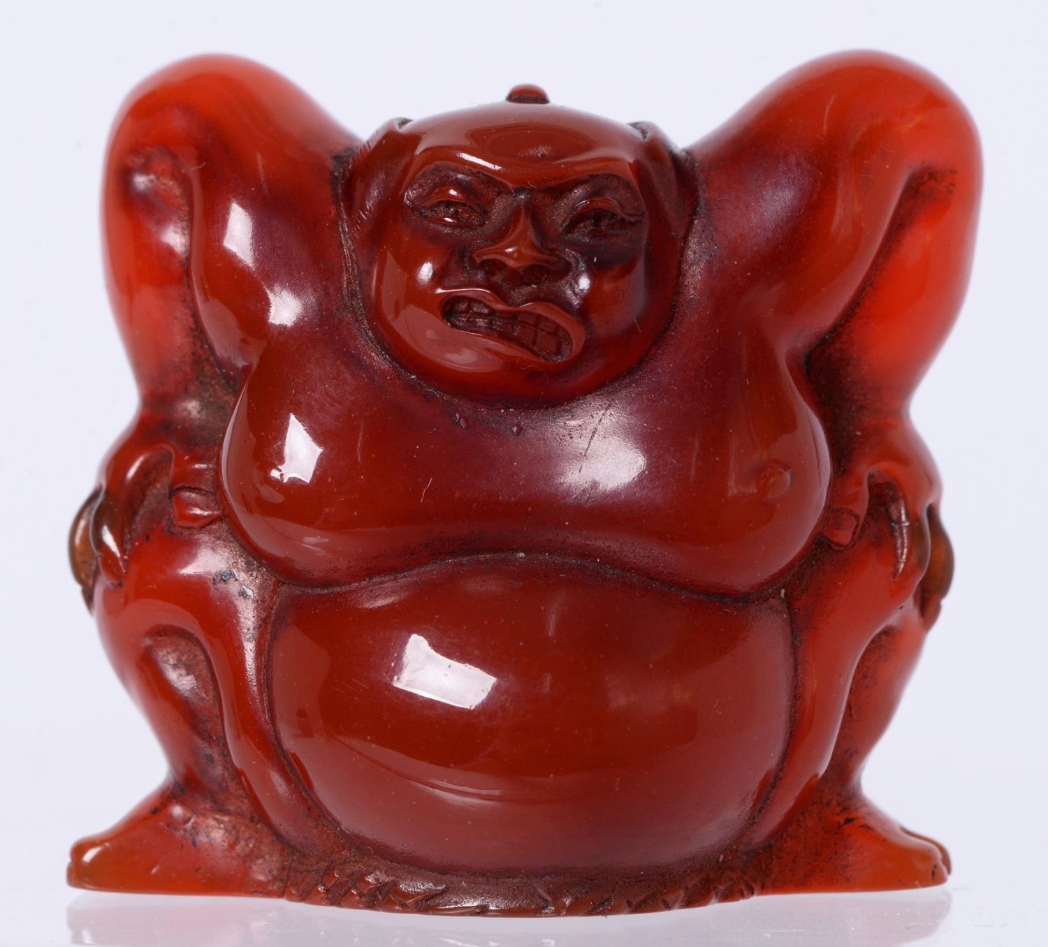 Amber | An amber netsuke of a sumo wrestler | MutualArt