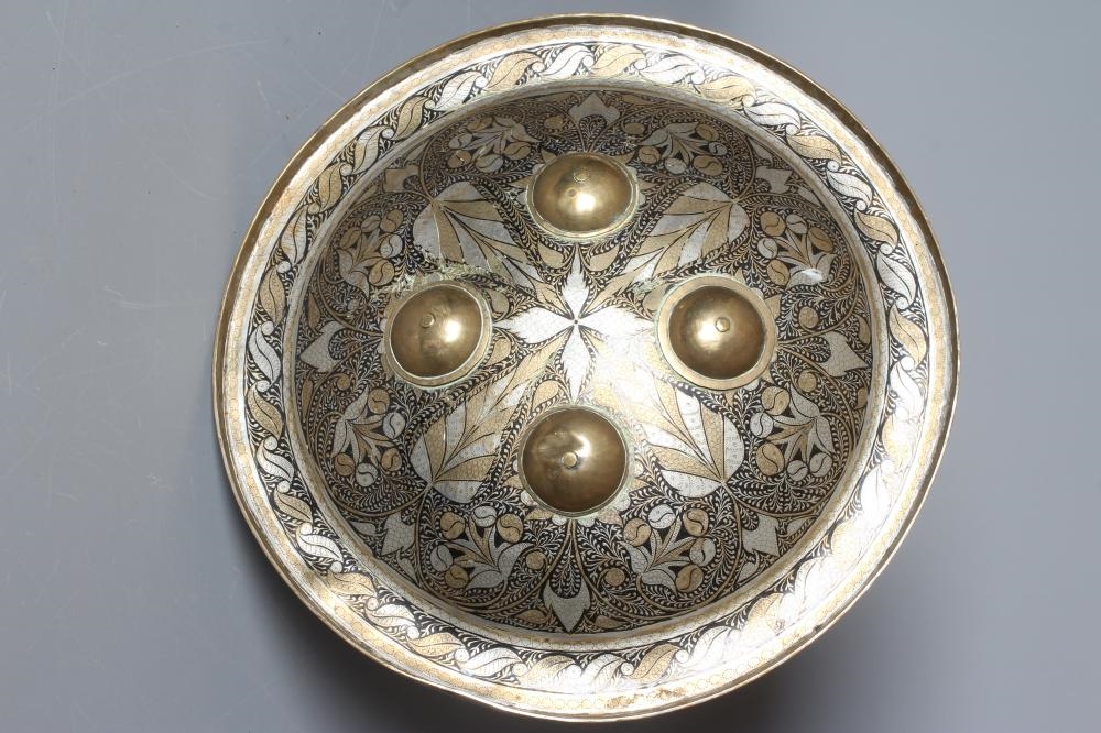 White | AN INDIAN CIRCULAR DHAL SHIELD with yellow and white metal ...
