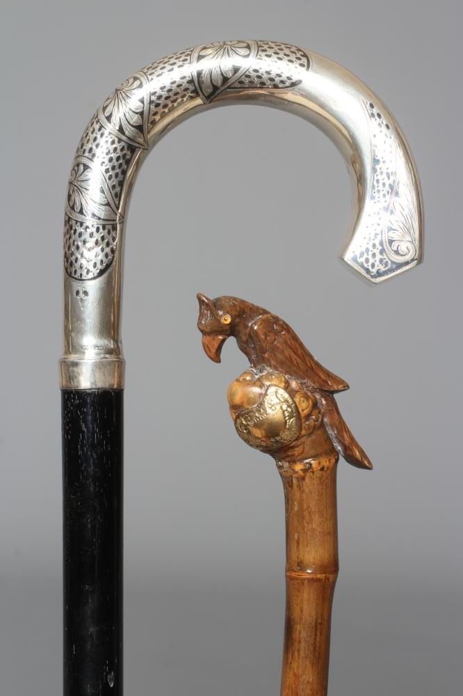 Unknown | A 15CT GOLD MOUNTED BAMBOO STYLE WALKING CANE with exotic ...