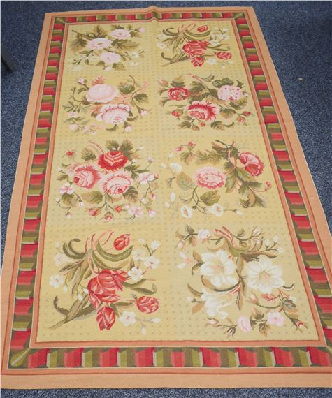 White | A French gros point tapestry rug depicting red | MutualArt
