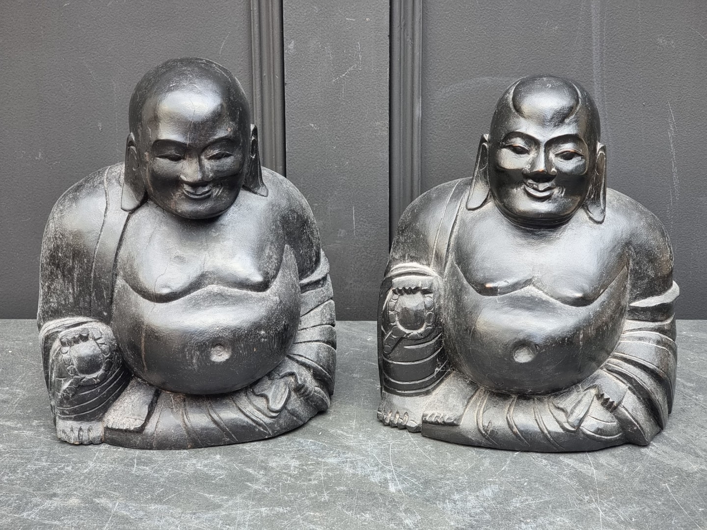 Similar | Two similar carved and ebonized Buddhas | MutualArt
