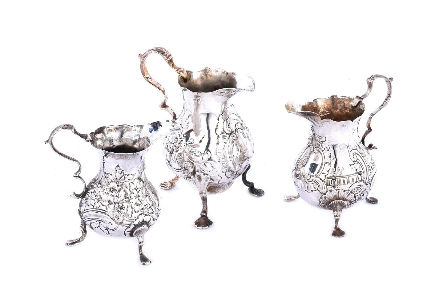 Hope K. Ritchie | THREE EMBOSSED SILVER CREAM JUGS | MutualArt