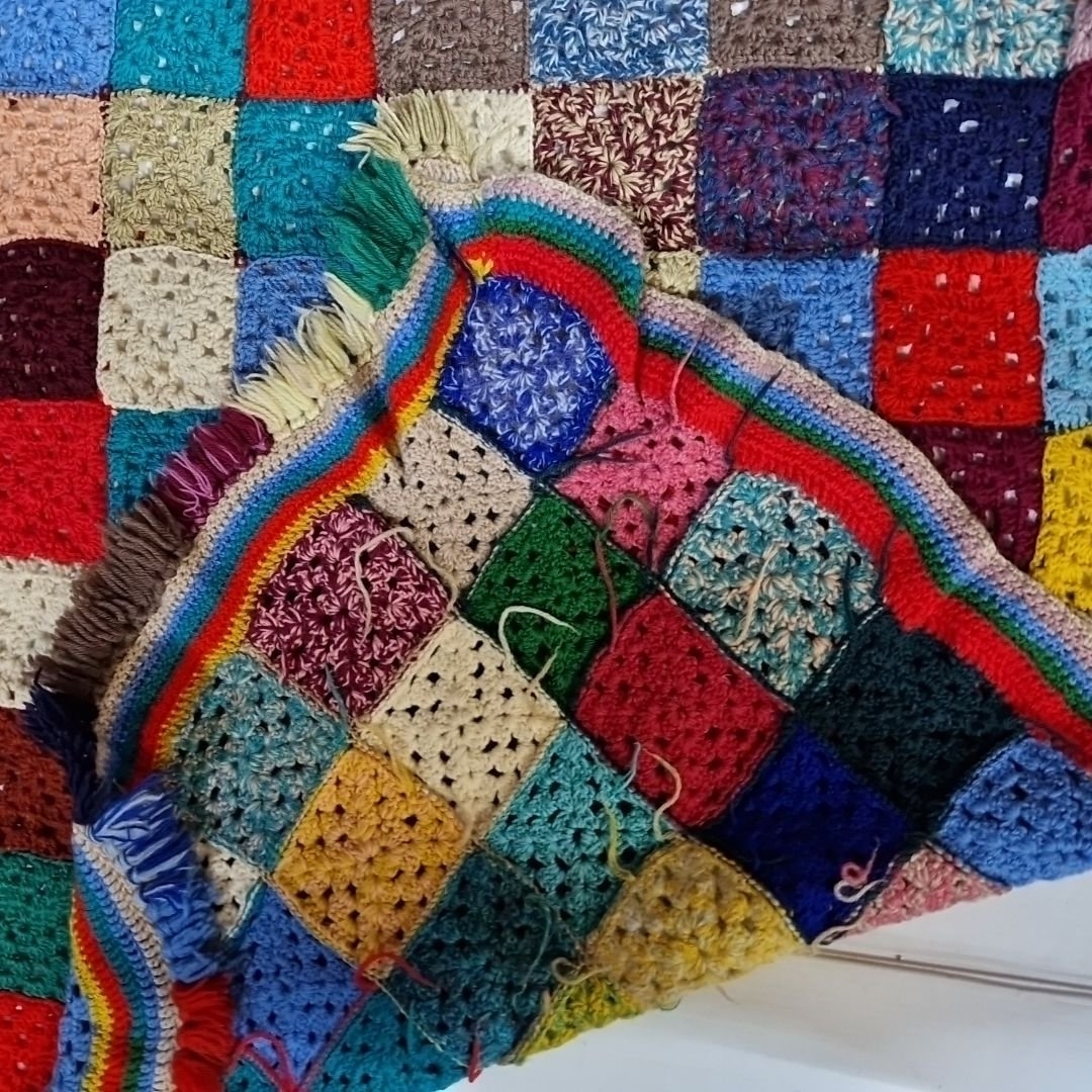 Fringe | A Multicolored crochet patchwork blanket with vibrant fringe ...