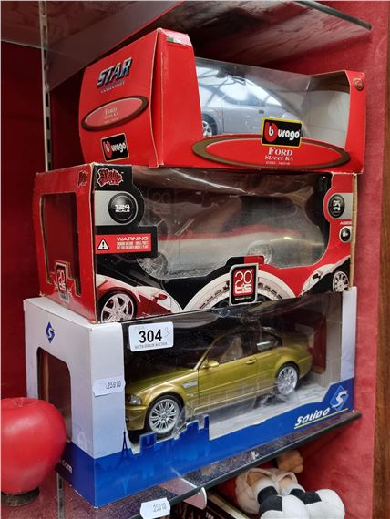 Hope K. Ritchie | Three collectible model cars including Burago Ford ...