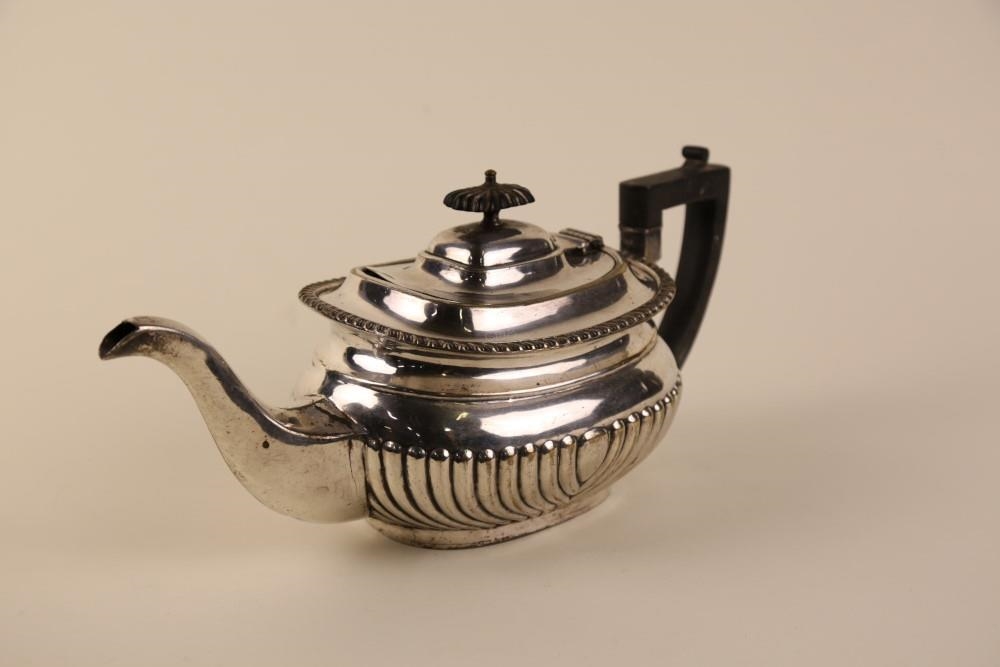 Guido Silvestri | An English silver tea pot with ebon handle. H 14cm ...