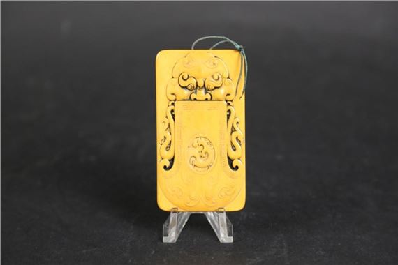 Dragon | A Chinese hand carved ivory pendant with carved dragon ...