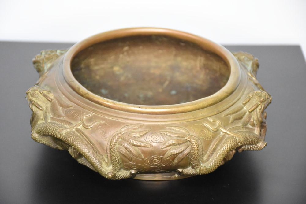 Dragon | A Chinese bronze sensor having raised dragon decoration ...