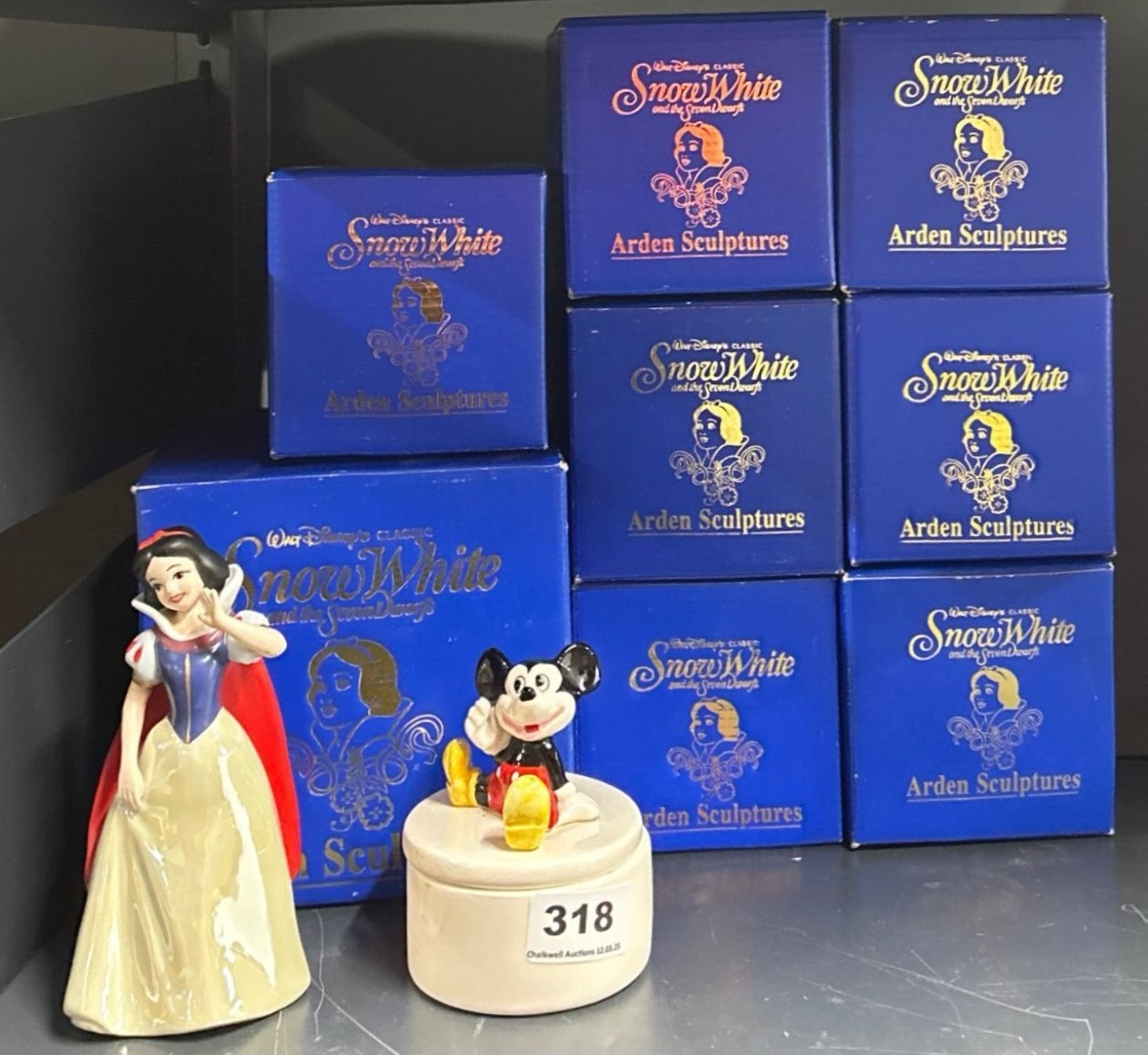 Arden | A group of Arden sculptures Disney figures with boxes | MutualArt