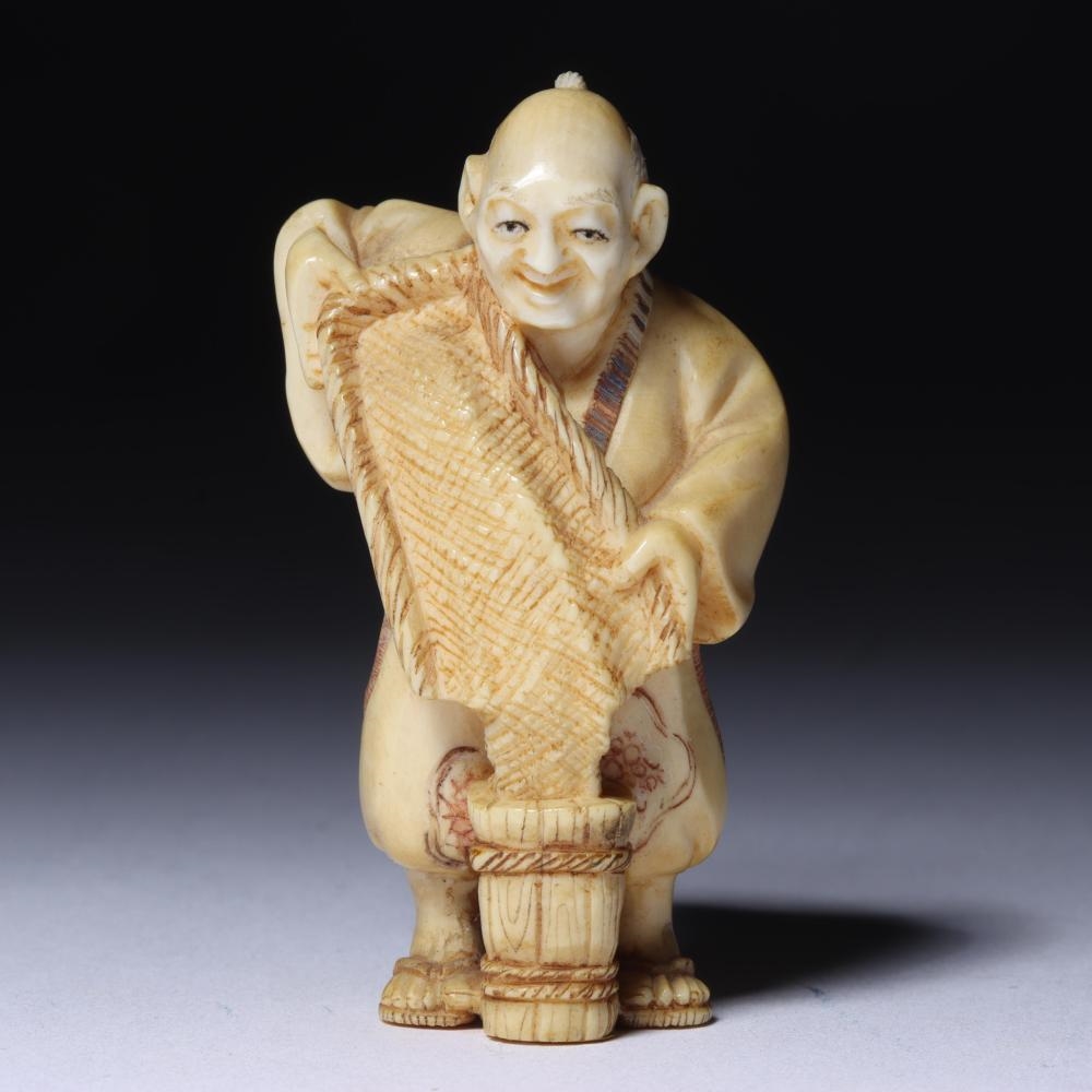 White | Japanese carved bone figural netsuke: elder man | MutualArt